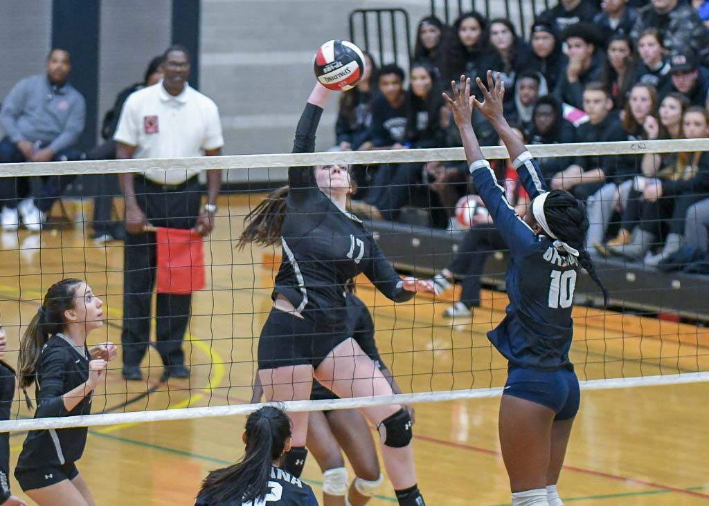 NW's Morgan Lowrey goes up to slam a volley | Montgomery Community Media